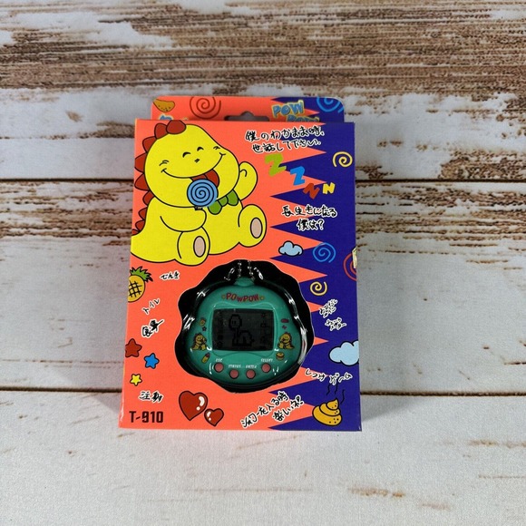 RakuRaku | Toys | Rare Electronic Virtual Pet Pow Pow Dinokun Teal ...